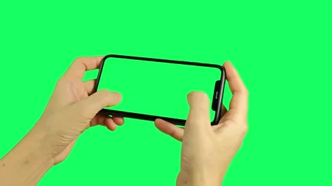Green screen of hand holding phone green... | Stock Video | Pond5