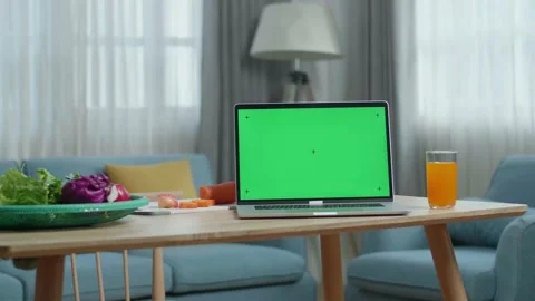 Green Screen Laptop On The Table With He... | Stock Video | Pond5