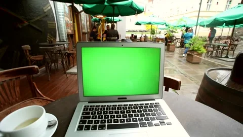 Green screen laptop on wooden table outd... | Stock Video | Pond5