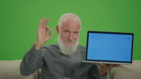 Green Screen. An Old Man with a Laptop w... | Stock Video | Pond5