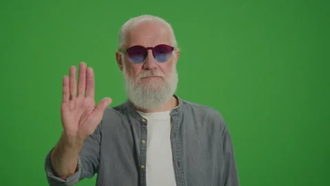 Green Screen.An Old Man Shows a Stop Sig... | Stock Video | Pond5