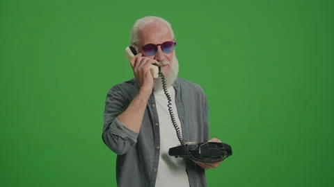 Green Screen. An Old Man is Talking on a... | Stock Video | Pond5