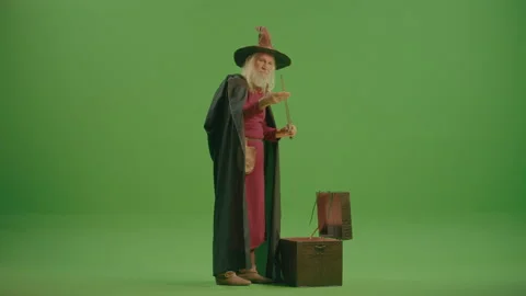 Green Screen. An Old Wizard Examines His... | Stock Video | Pond5