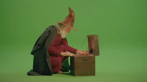 Green Screen. An Old Wizard Opens a Magi... | Stock Video | Pond5