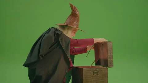 Green Screen. An Old Wizard Opens a Magi... | Stock Video | Pond5