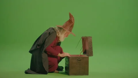 Green Screen. An Old Wizard Opens a Magi... | Stock Video | Pond5