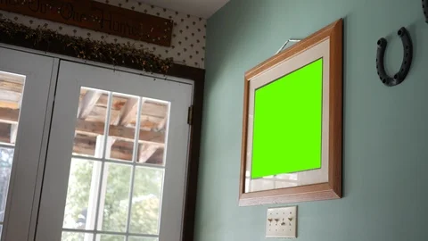 A green screen picture frame hanging on ... | Stock Video | Pond5