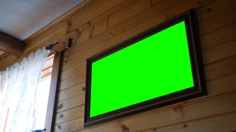A green screen picture frame hanging on ... | Stock Video | Pond5