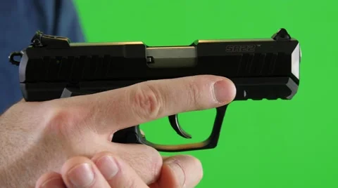 Green screen shot man with a 22 pistol | Stock Video | Pond5