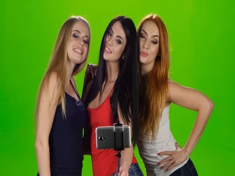 Green screen studio. Three girl model po... | Stock Video | Pond5
