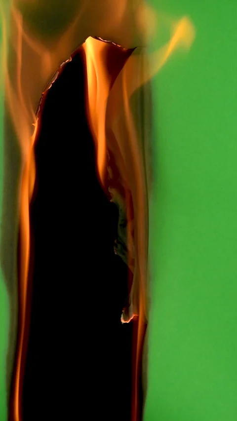 Green screen VERTICAL burning Black behi... | Stock Video | Pond5