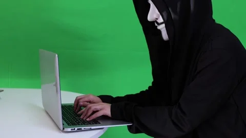 Green screen video of masked hacker typi... | Stock Video | Pond5