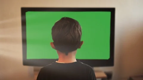 Green screen young boy staring at tv scr... | Stock Video | Pond5