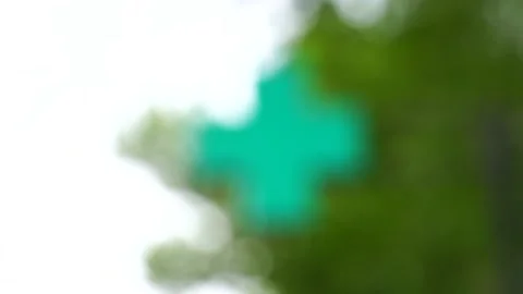 green sign of pharmacy cross with blur a... | Stock Video | Pond5