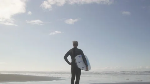 Grey Haired Surfer Man Standing on the B... | Stock Video | Pond5