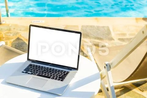 Grey laptop computer open with keyboard on deckchair ~ Premium Photo ...