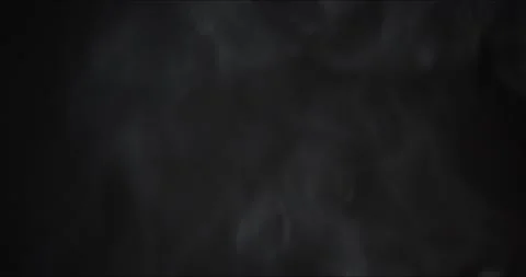 Grey smoke is rising and spreading on bl... | Stock Video | Pond5