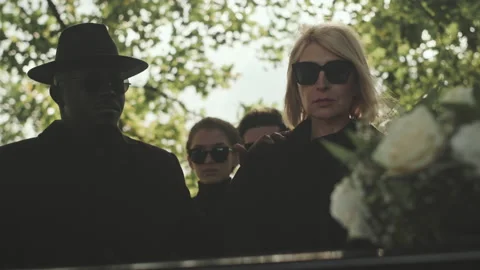 Grieving People at Outdoor Funeral Cerem... | Stock Video | Pond5