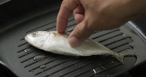 Grilled Mackerel fish on a hot pan. | Stock Video | Pond5