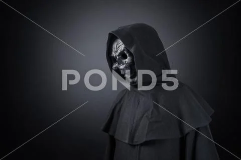 Grim reaper over dark misty background ~ Premium Photo #195936769