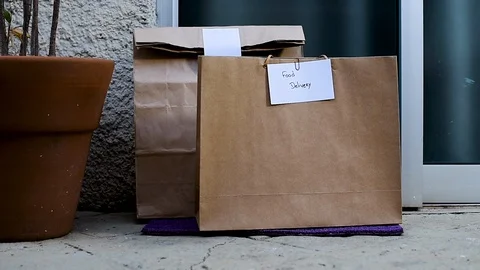 Grocery bag left at the door by delivery... | Stock Video | Pond5