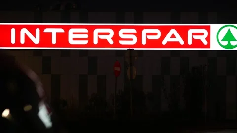 Grocery store with glowing Interspar log... | Stock Video | Pond5