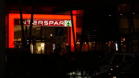 Grocery store with glowing Interspar log... | Stock Video | Pond5