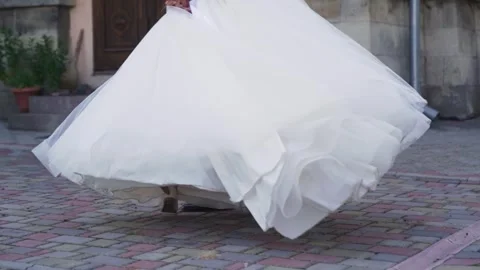 Groom spinning bride holding on his hand... | Stock Video | Pond5
