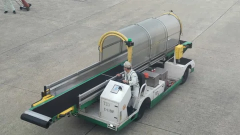 ground crew baggage handling vehicle tao... | Stock Video | Pond5