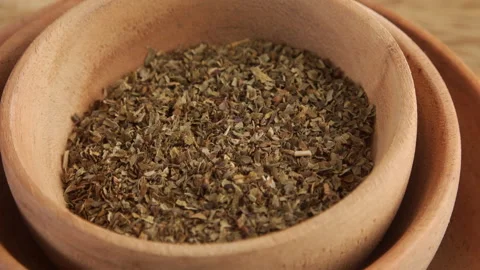 Ground dried basil spice close up rotati... | Stock Video | Pond5