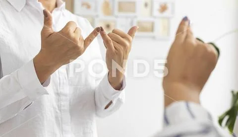 Photograph: Group deaf people communicating through sign language ...