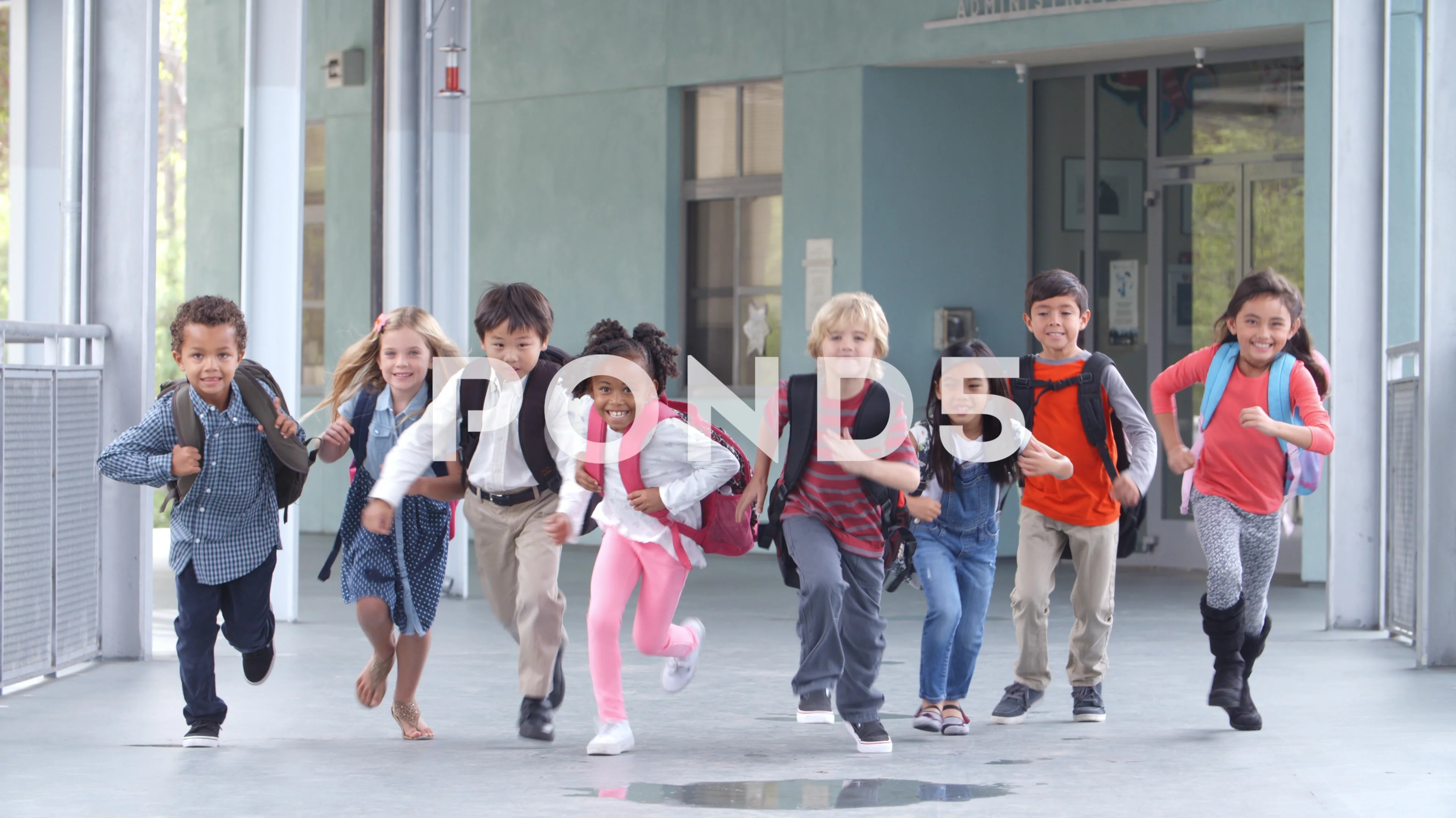 Group Of Elementary School Kids Running In A School School Kids