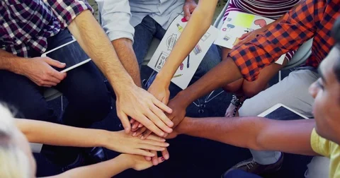Group of executives forming hand stack 4... | Stock Video | Pond5