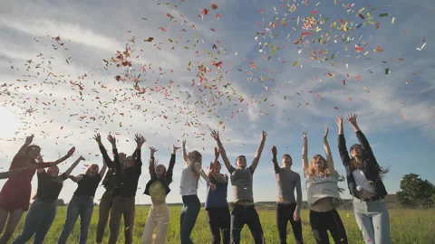 A group of friendly friends toss up cand... | Stock Video | Pond5