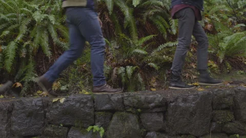Group of Friends in Muddy Boots Walk Thr... | Stock Video | Pond5