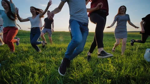 Group of friends running happily togethe... | Stock Video | Pond5