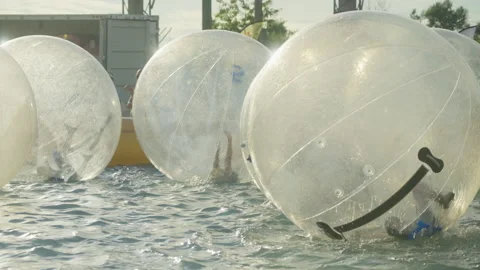 Group of kids playing in giant inflated ... | Stock Video | Pond5