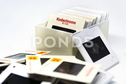 A group of Kodachrome brand slides from the 70s inside a plastic box ...