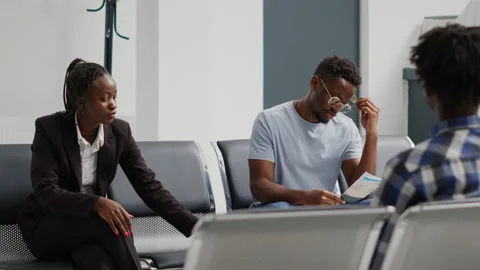 Group of patients sitting in hospital wa... | Stock Video | Pond5