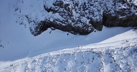 A group of people climb the snowy peak. ... | Stock Video | Pond5