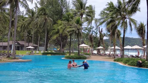 a group of people dancing in the pool wi... | Stock Video | Pond5