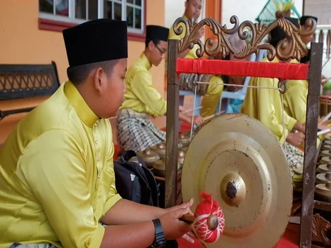 A group of people playing Cak Lempong in... | Stock Video | Pond5