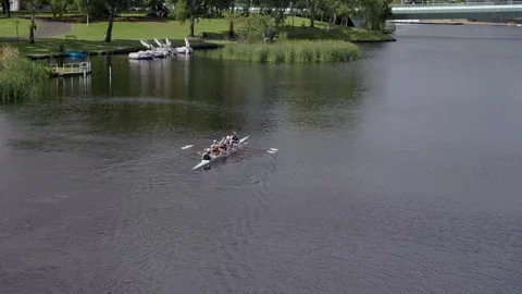 Group of People Rowing a Row Boat in the... | Stock Video | Pond5