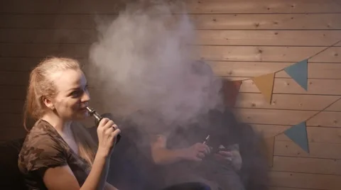 A group of people vaping, inhaling and e... | Stock Video | Pond5