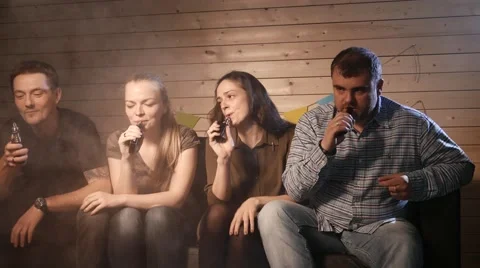 A group of people vaping, inhaling and e... | Stock Video | Pond5