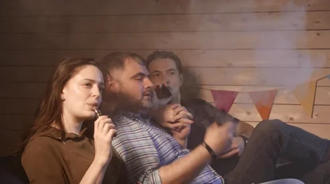 A group of people vaping, inhaling and e... | Stock Video | Pond5