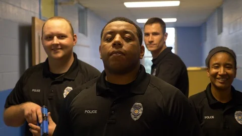 Group of police officers smile | Stock Video | Pond5