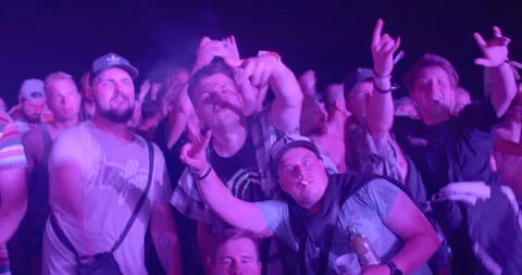 Group ravers huddle together dance-flour... | Stock Video | Pond5