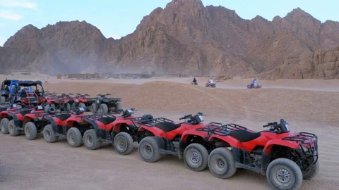 Group of Red Quad Bikes stand in a parki... | Stock Video | Pond5