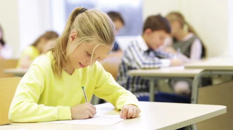 group of school kids writing test in cla... | Stock Video | Pond5